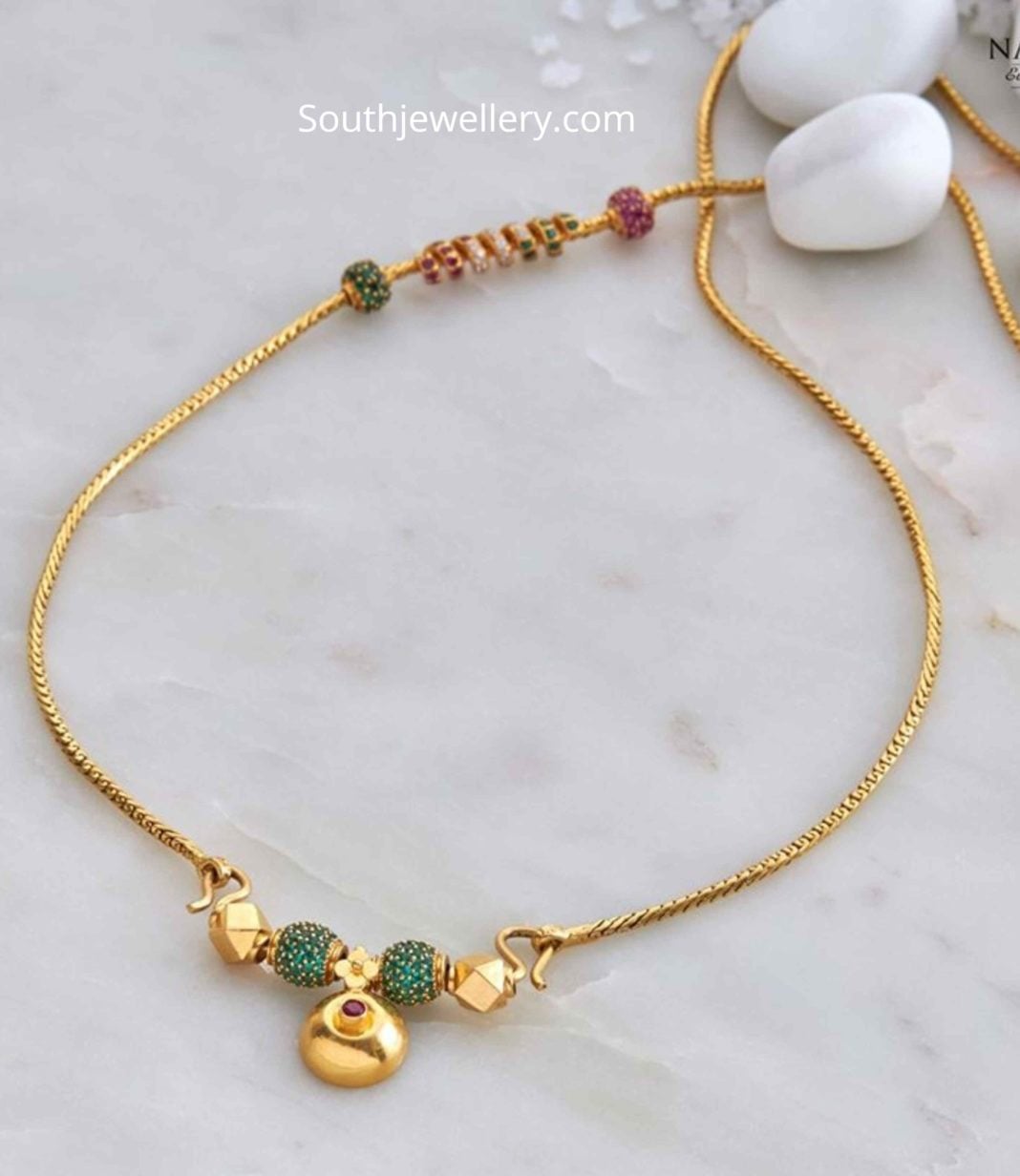 Fancy Thali chain with rubies and emeralds - Indian Jewellery Designs